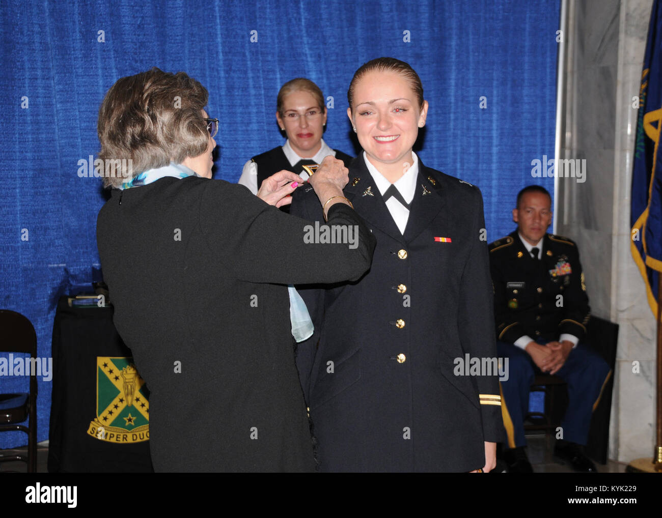 Newly promoted 2nd Lt. Stella Hundley receives her new rank from her ...