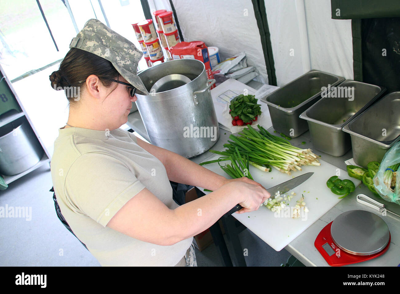 Spc. Juanita Herald with the 2112th Mess Team competes in the ...