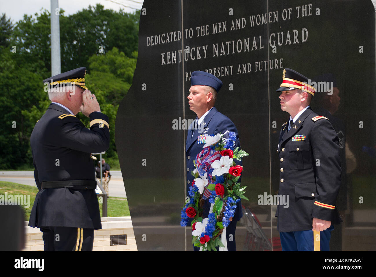 Brig. Gen. Benjamin Adams III salutes a commemorative wreath on ...