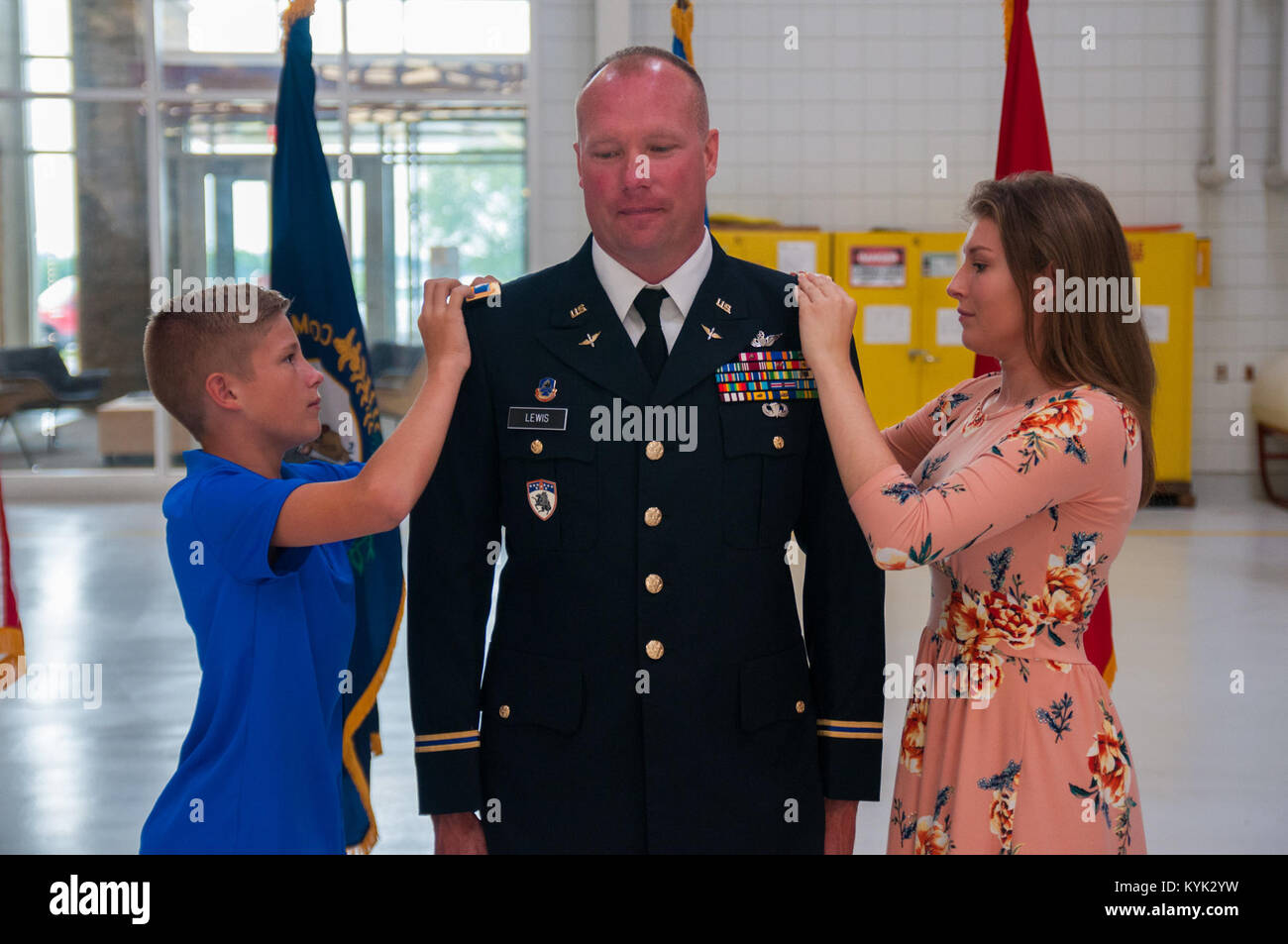 The children of Col. Gary D. Lewis pin colonel’s rank insignia to his ...