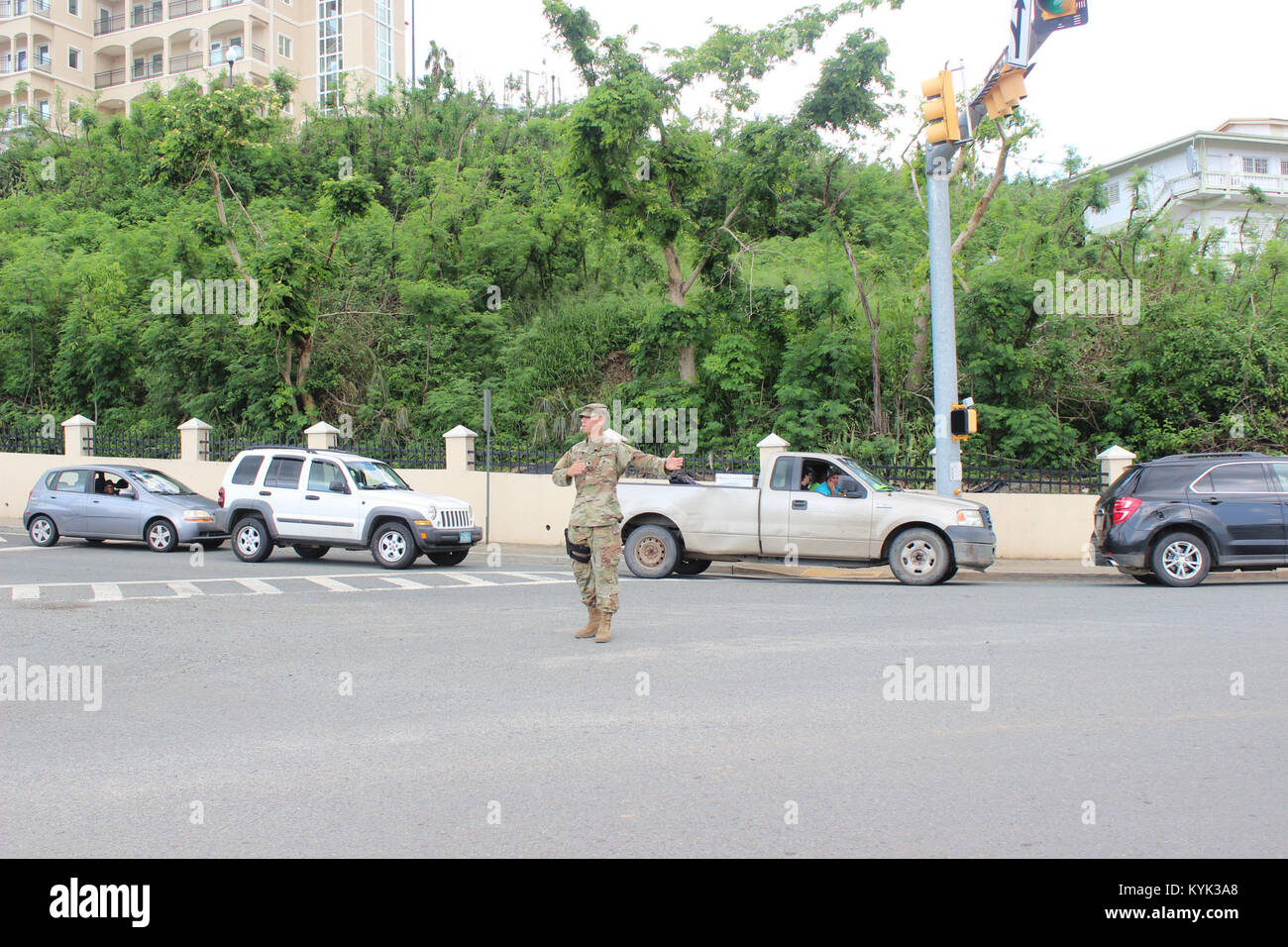 A Soldier with the 940th Military Police Company directs traffic in St ...