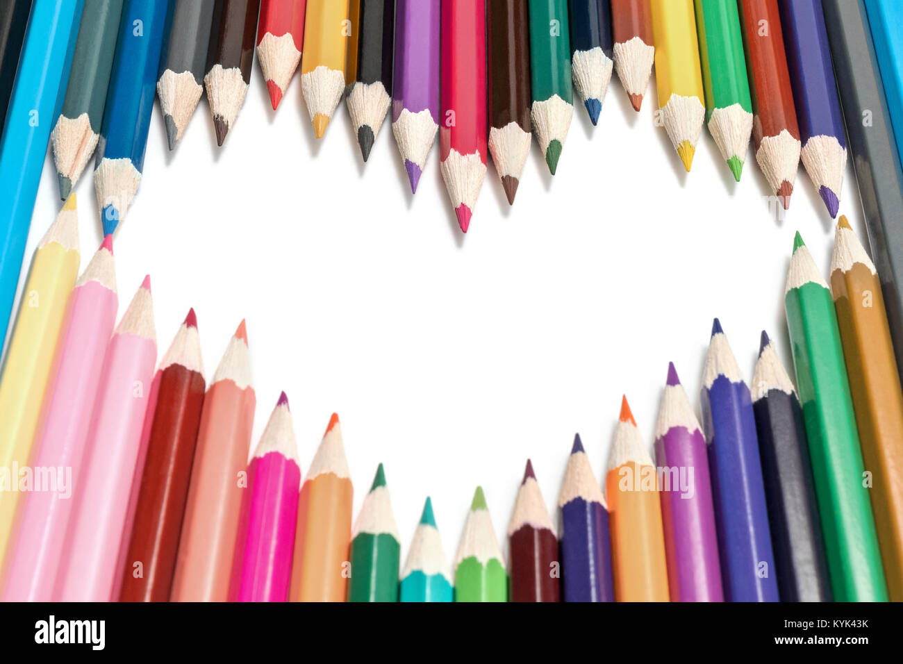 Set of colored pencils lined in heart shape, isolated on white ...