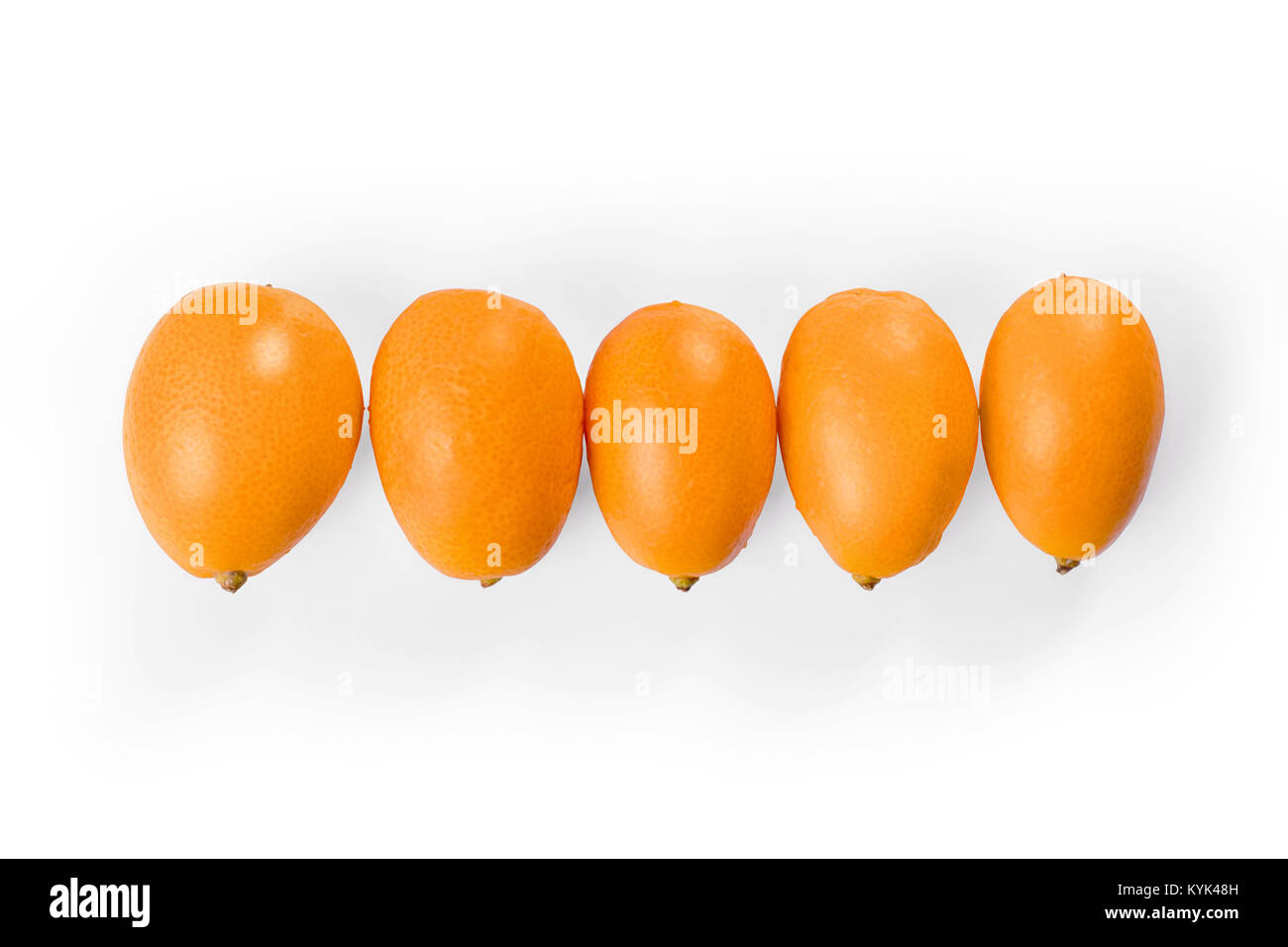 Small orange kumquat citrus fruits in the row. Isolated on white ...