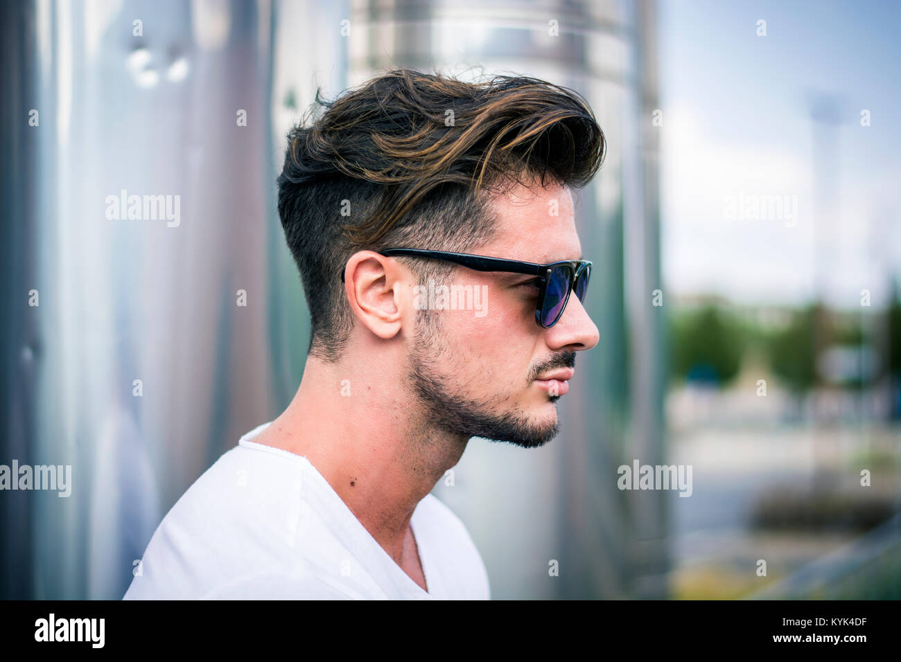 One handsome young man in city setting Stock Photo - Alamy