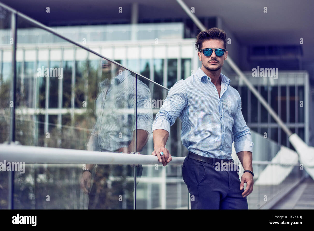 One handsome young man in city setting Stock Photo - Alamy