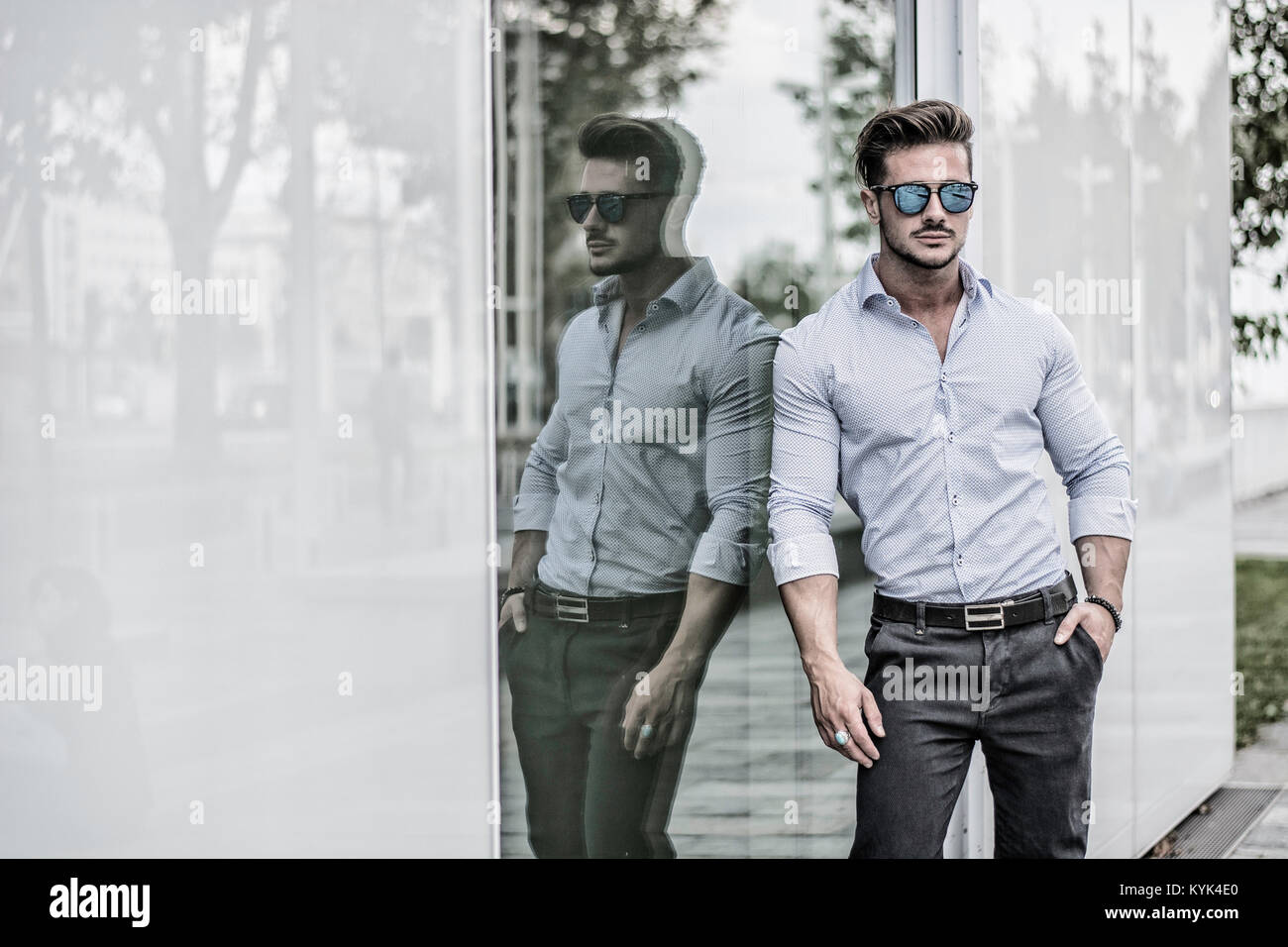 One handsome young man in city setting Stock Photo - Alamy