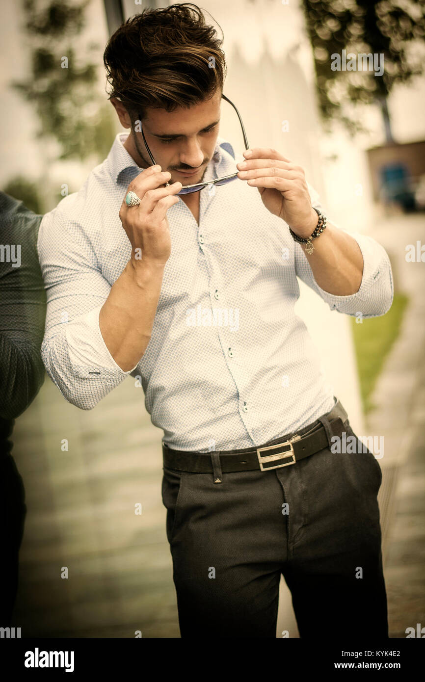 One handsome young man in city setting Stock Photo - Alamy