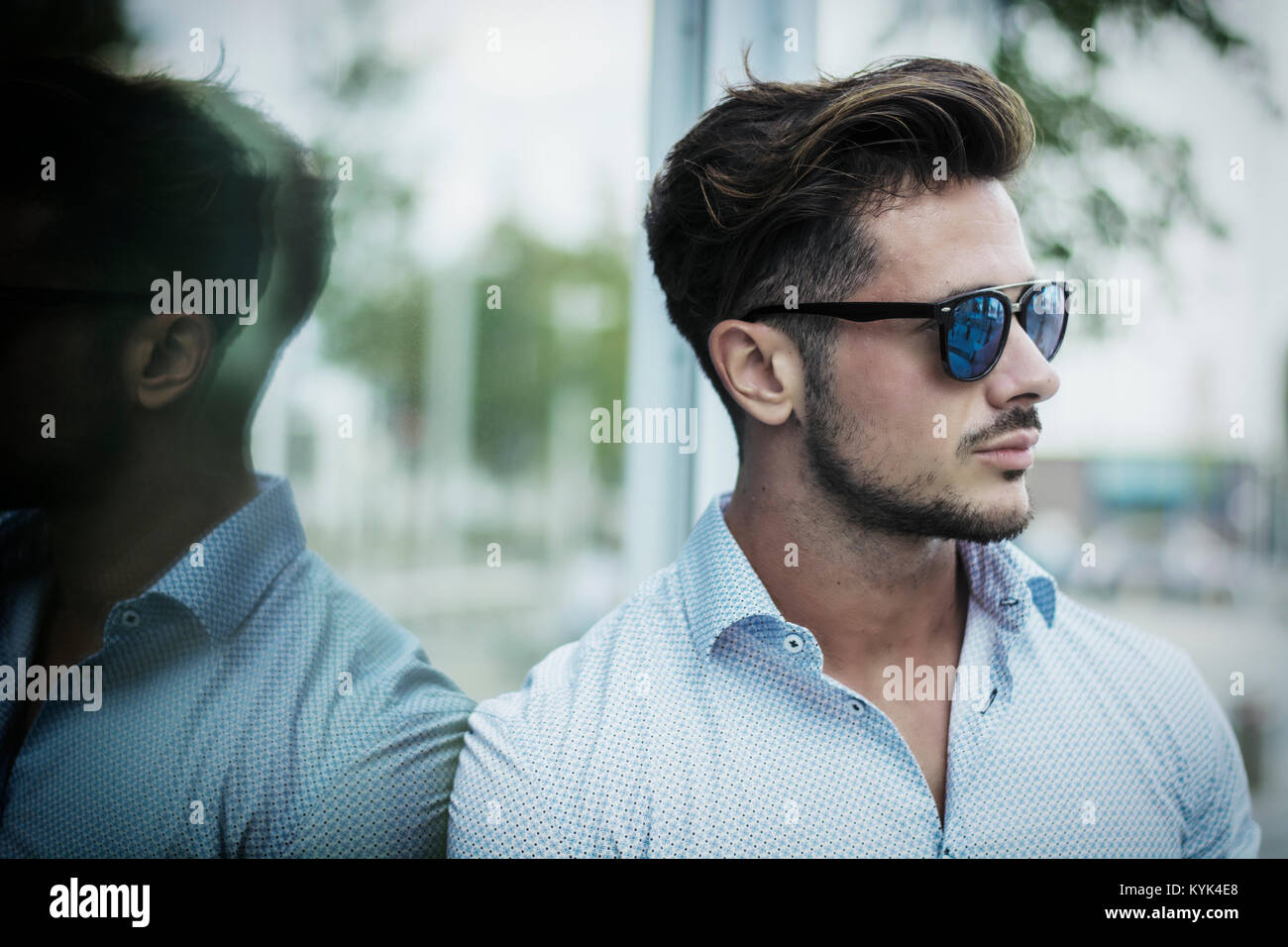 One handsome young man in city setting Stock Photo - Alamy