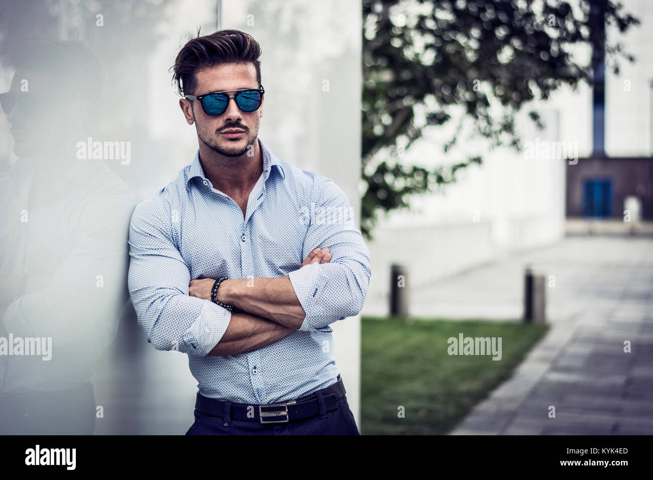 One handsome young man in city setting Stock Photo - Alamy