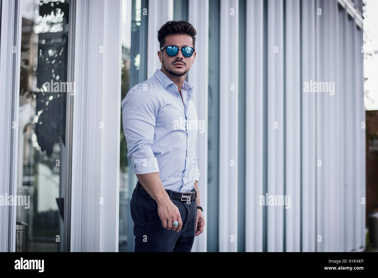 One handsome young man in city setting Stock Photo - Alamy