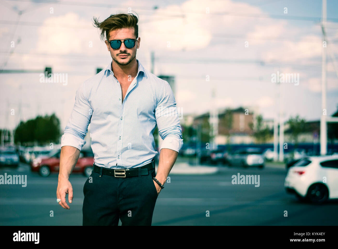 One handsome young man in city setting Stock Photo - Alamy