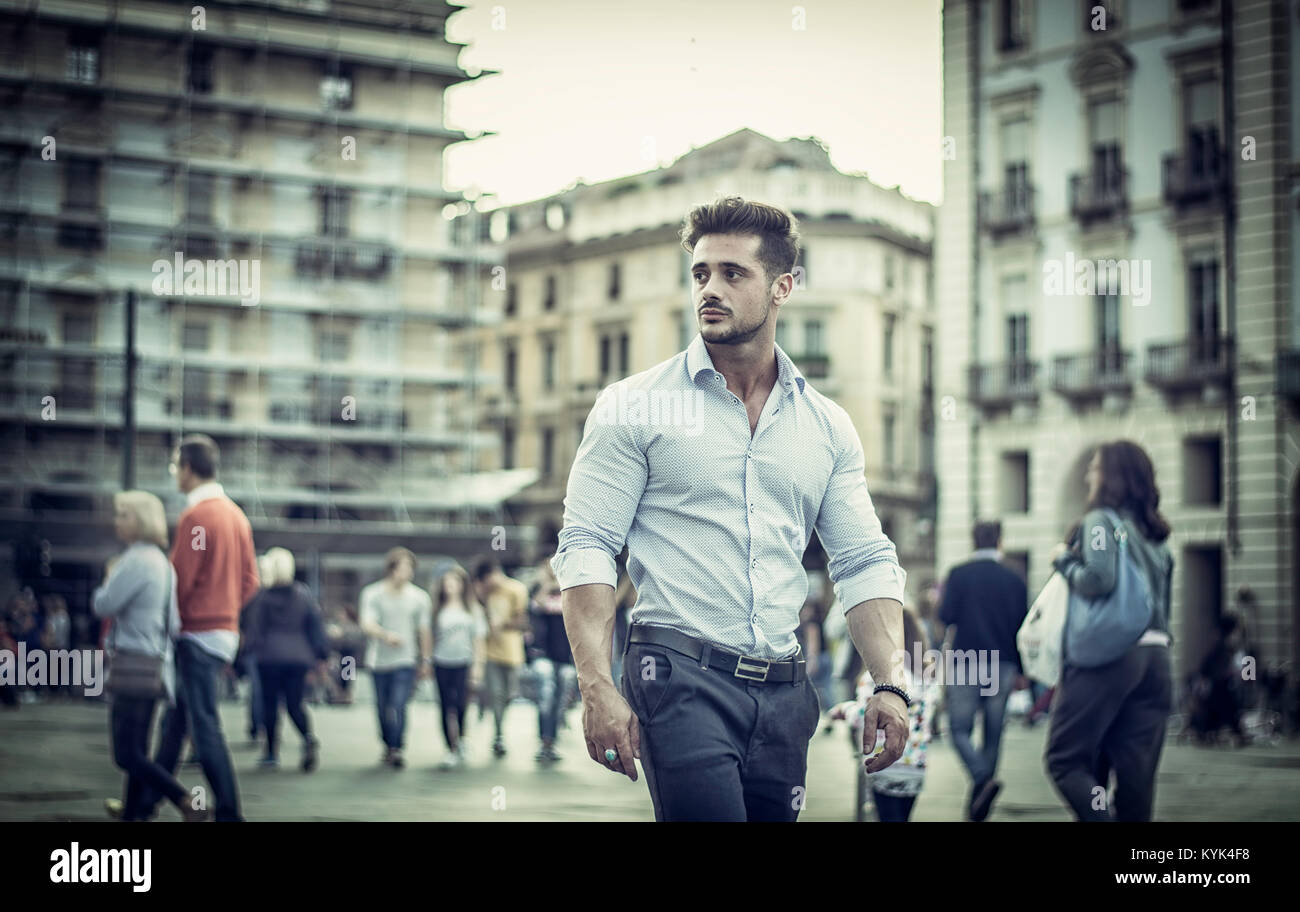 One handsome young man in city setting Stock Photo - Alamy