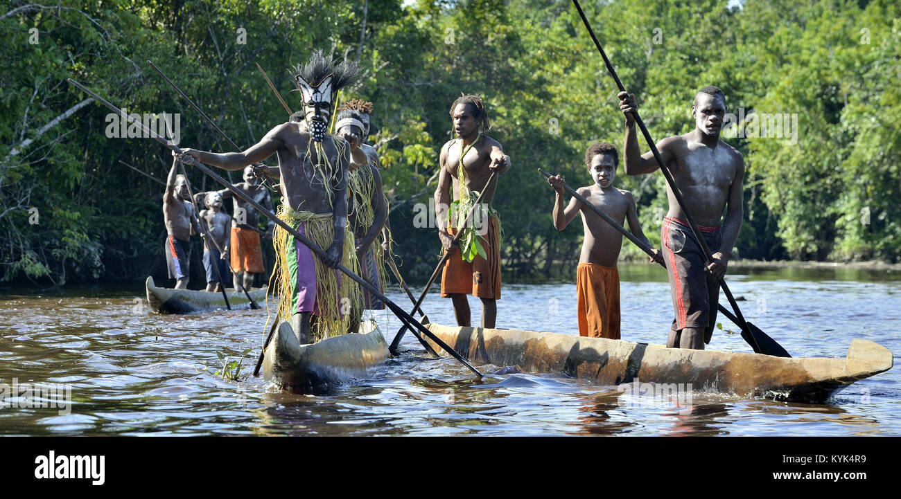 Canoe war ceremony of Asmat people. Headhunters of a tribe of Asmat ...