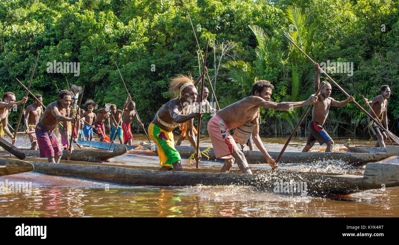 Canoe war ceremony of Asmat people. Headhunters of a tribe of Asmat ...