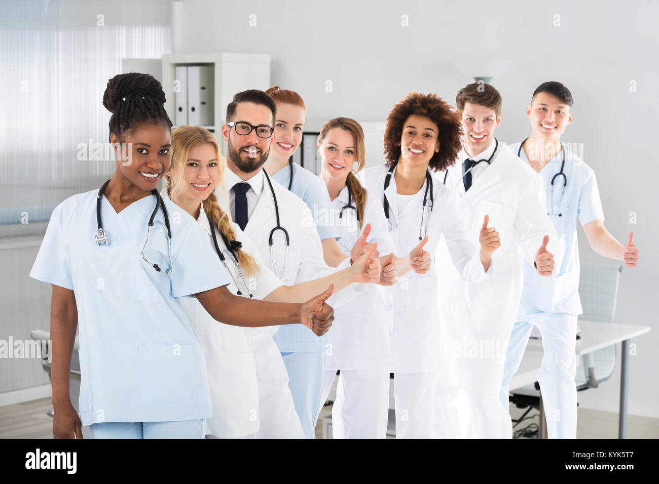 Group Of Multi Ethnic Male And Female Doctors Showing Thumb Up Sign In ...