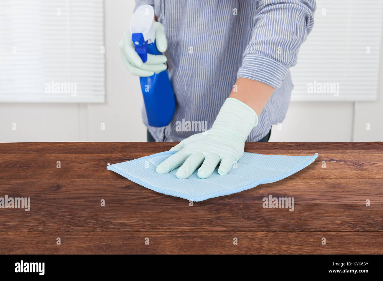 Close-up Of A Janitor's Hand Cleaning Wooden Desk With Rag Stock Photo ...