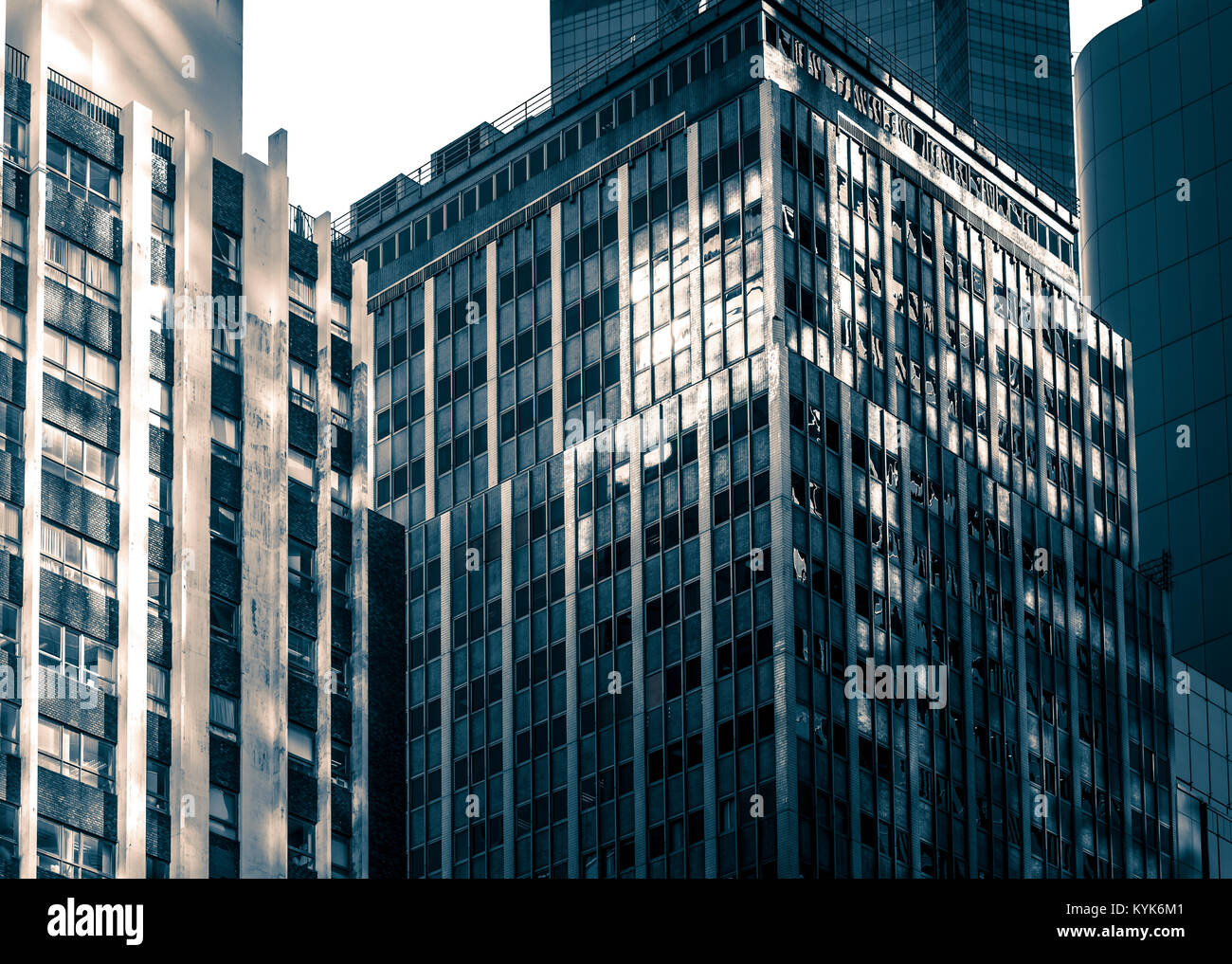 Modern office building close up in sunlight Stock Photo - Alamy