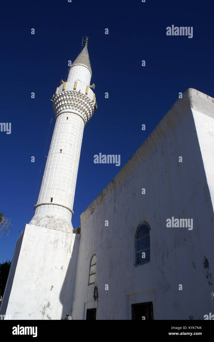 Minaret and white mosque on the sea shore in Bodrum, Turkey Stock Photo ...