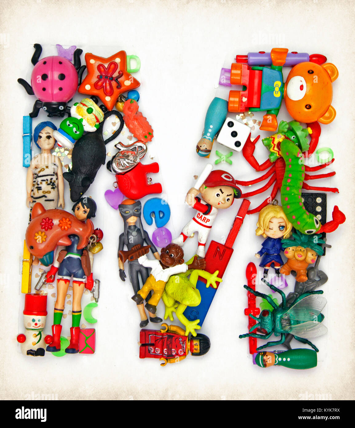 the letter M made from small toys Stock Photo - Alamy