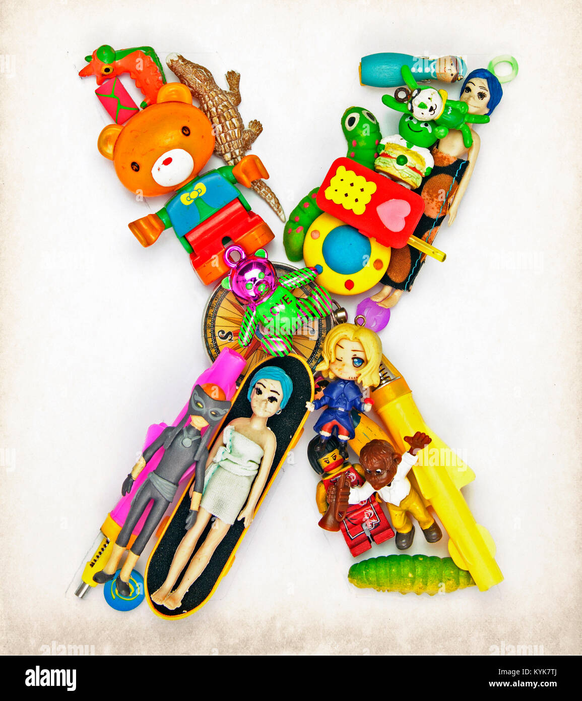 the letter X made from small toys Stock Photo - Alamy