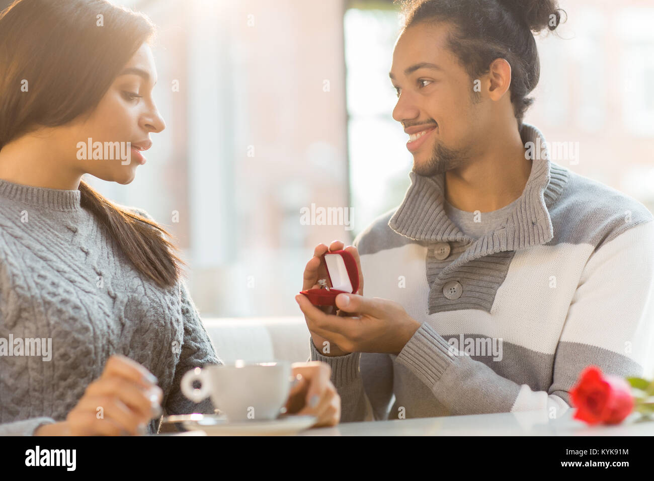 Woman giving guy gift hi-res stock photography and images - Alamy