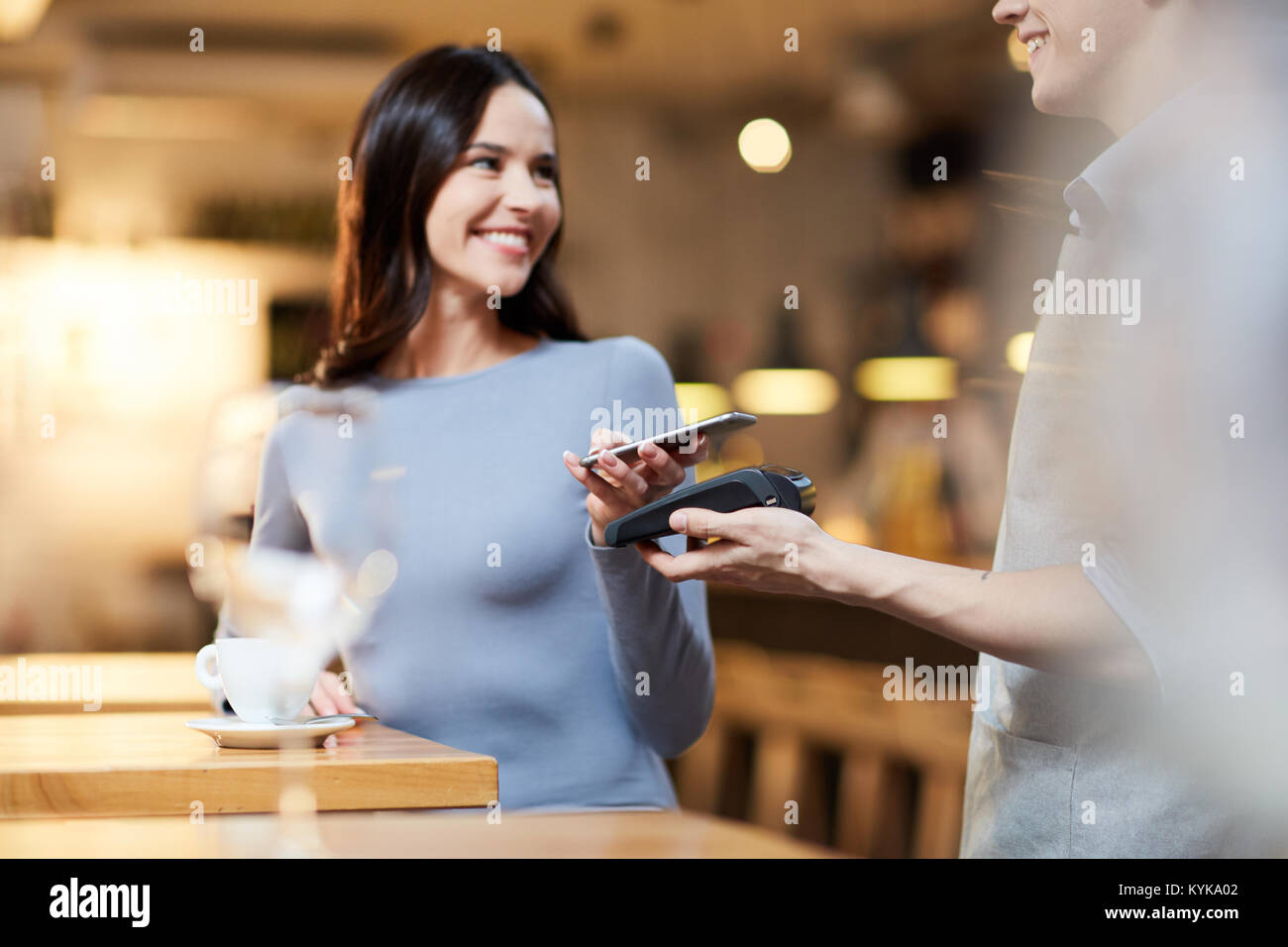 Paying by smartphone Stock Photo - Alamy