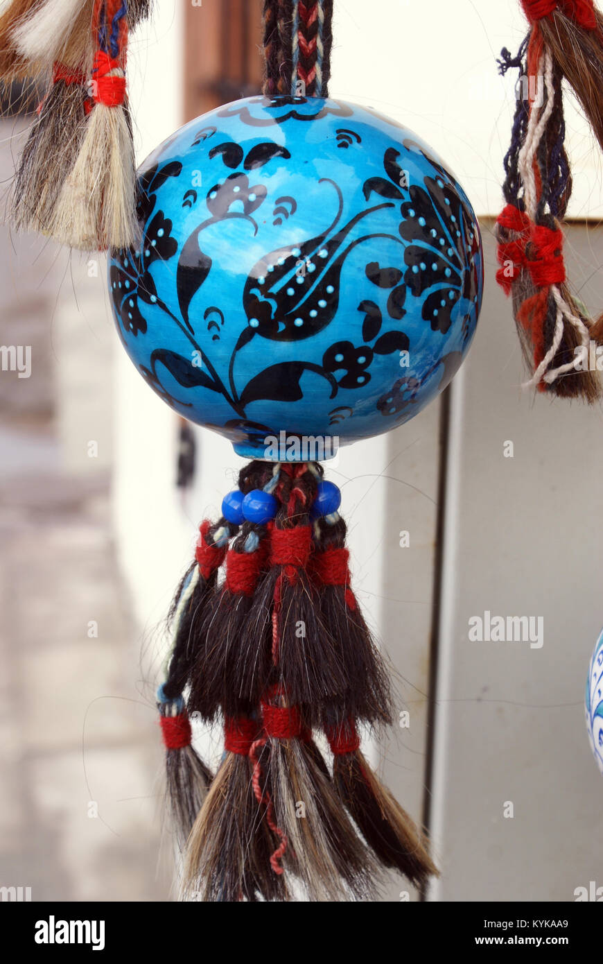 Ceramic blue ball on the rope Stock Photo - Alamy