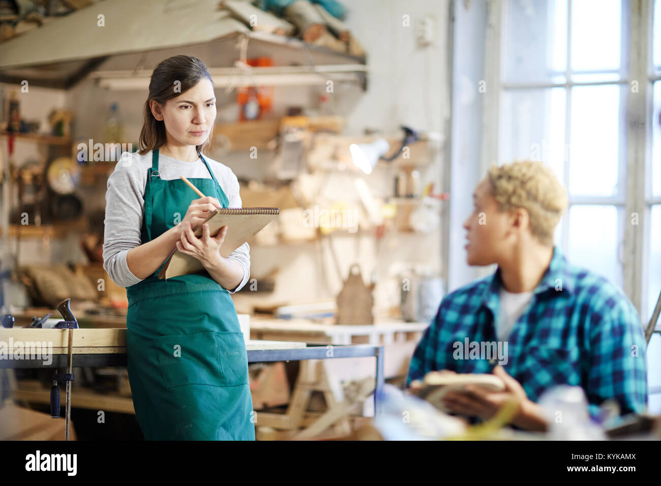 Working in group Stock Photo - Alamy