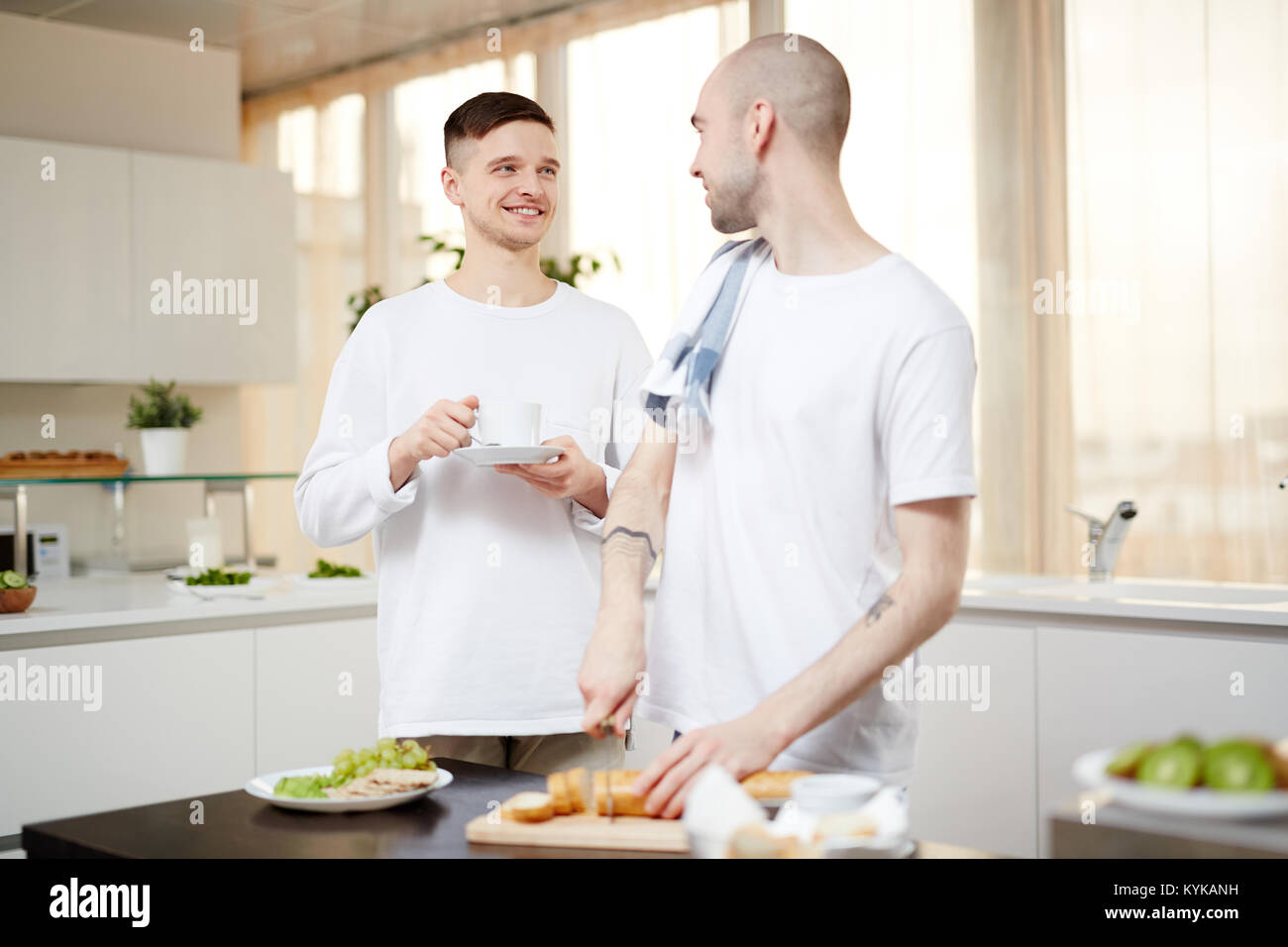 Gay couple cooking together hi-res stock photography and images - Alamy