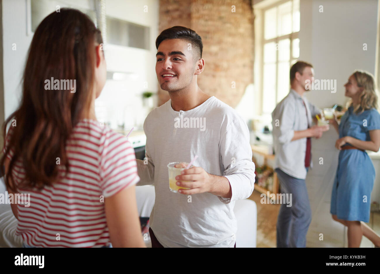 Couples talking party hi-res stock photography and images - Alamy