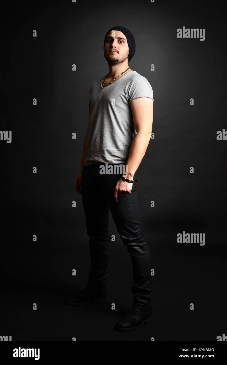 Rock singer portrait, with leather jacket and a cool attitude on black ...