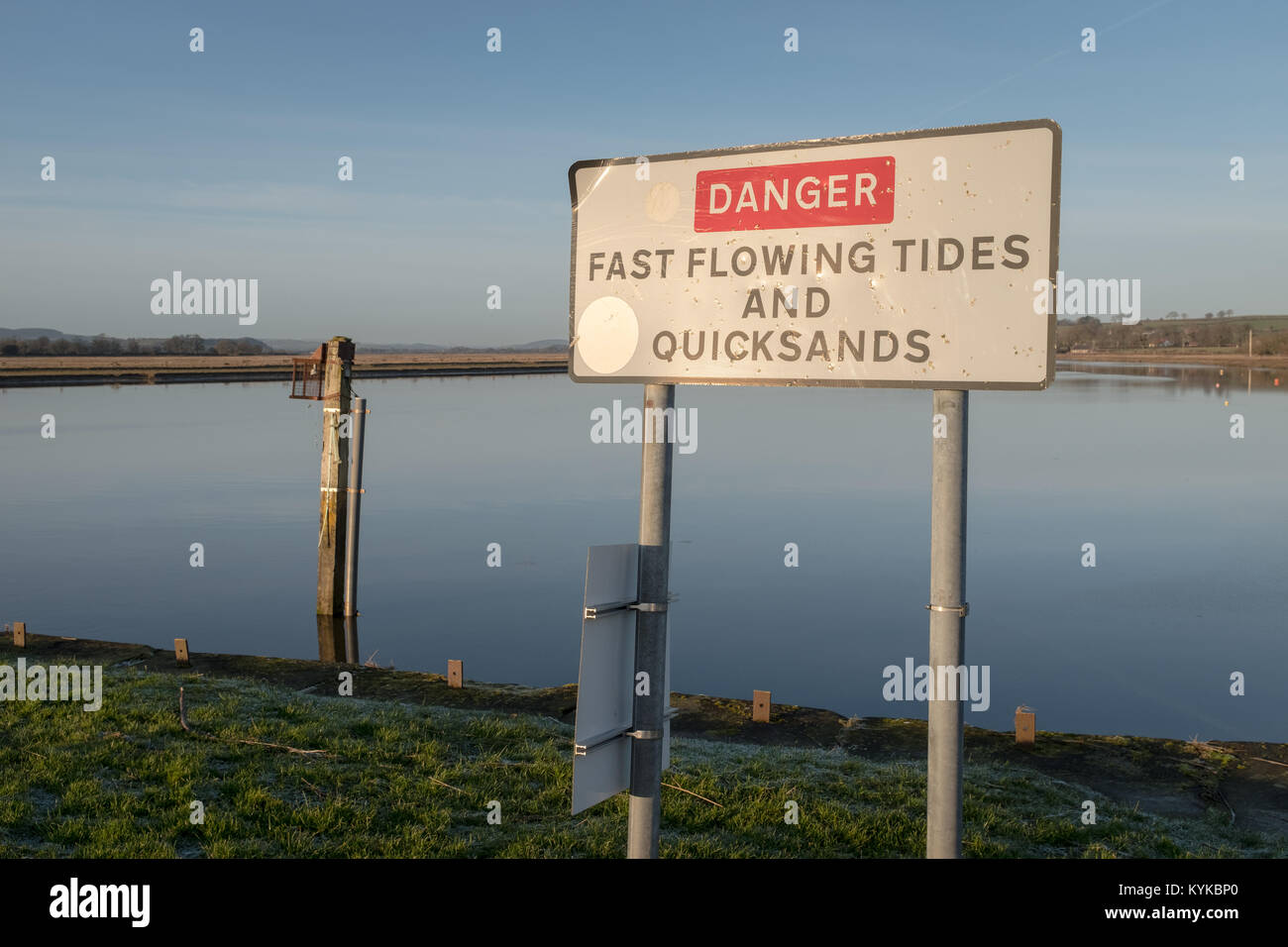 Warning signs at the harbour in Glencaple village, Scotland, on a sunny ...