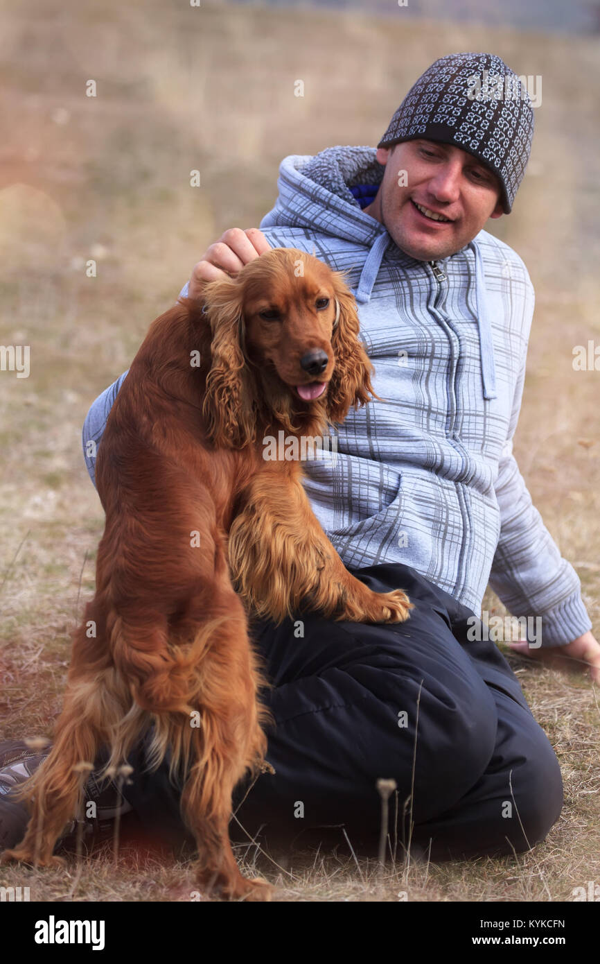 young happy man and his god in autumn meados Stock Photo - Alamy