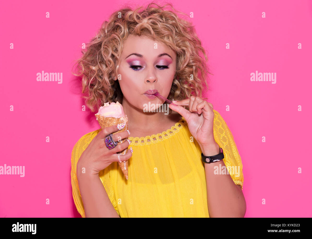 Woman licking strawberry hi-res stock photography and images - Alamy