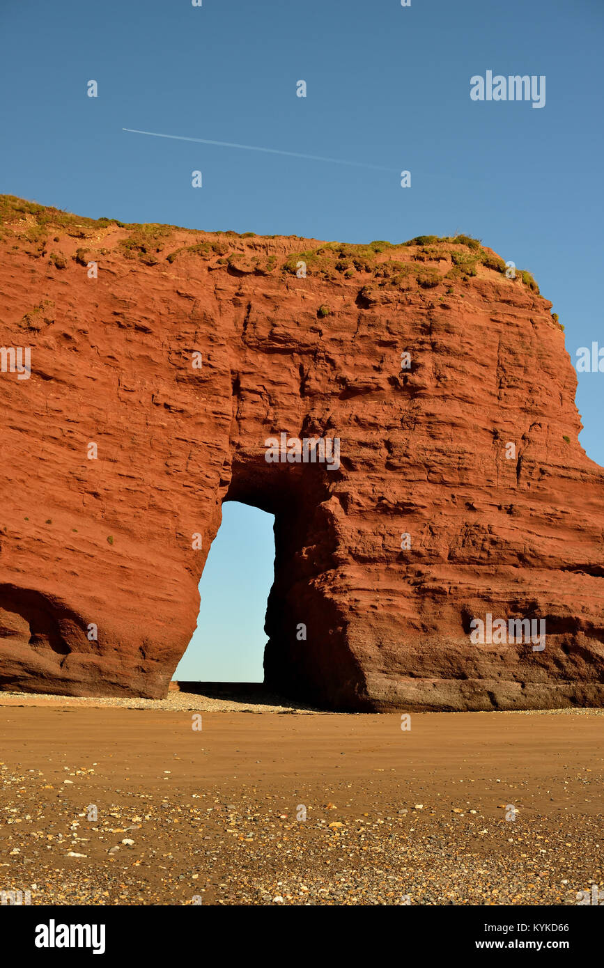 Archway in Langstone Rock at low tide Stock Photo - Alamy