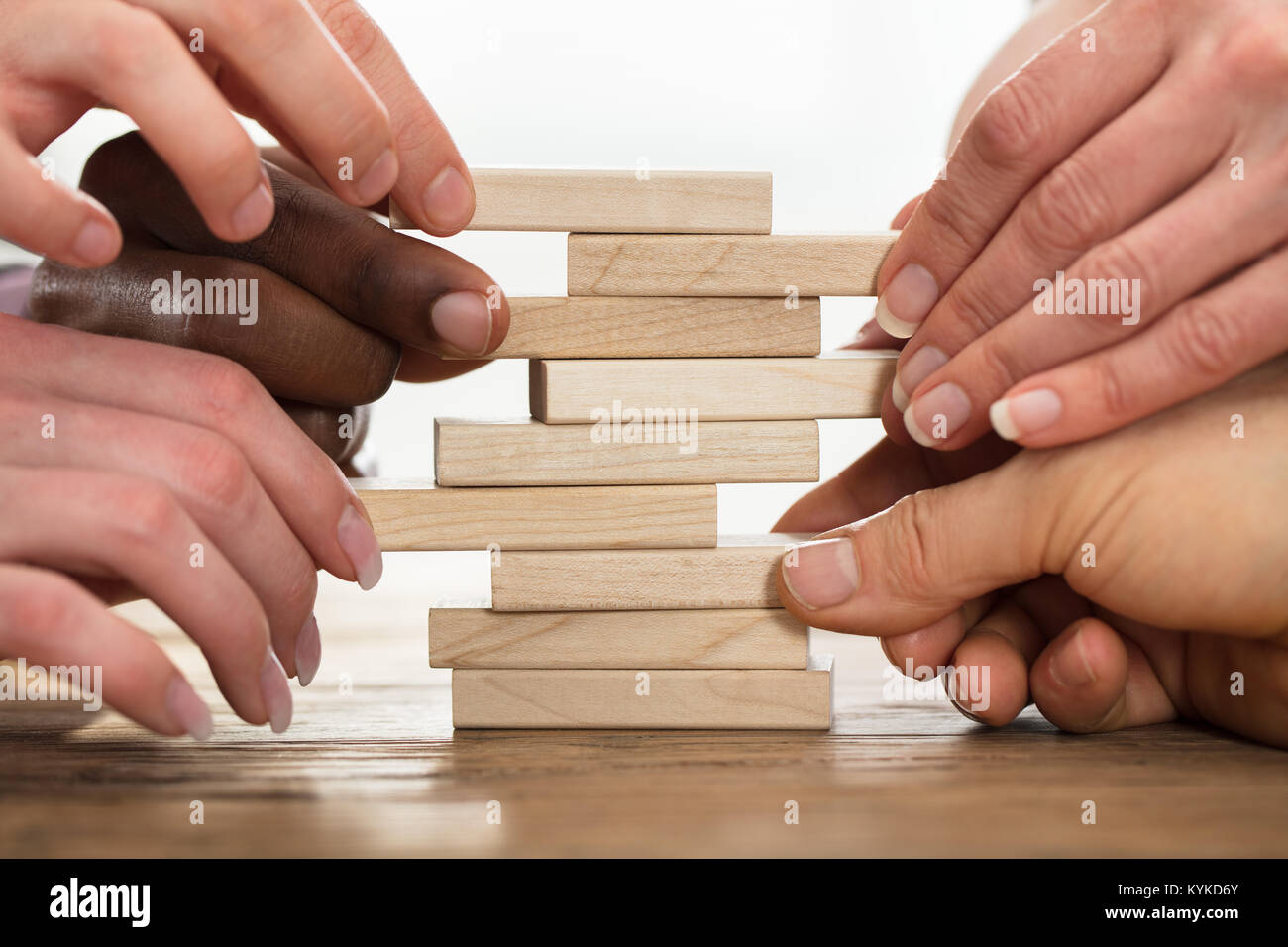 Close-up Of Businesspeople's Hand Stacking Wooden Blocks Stock Photo ...
