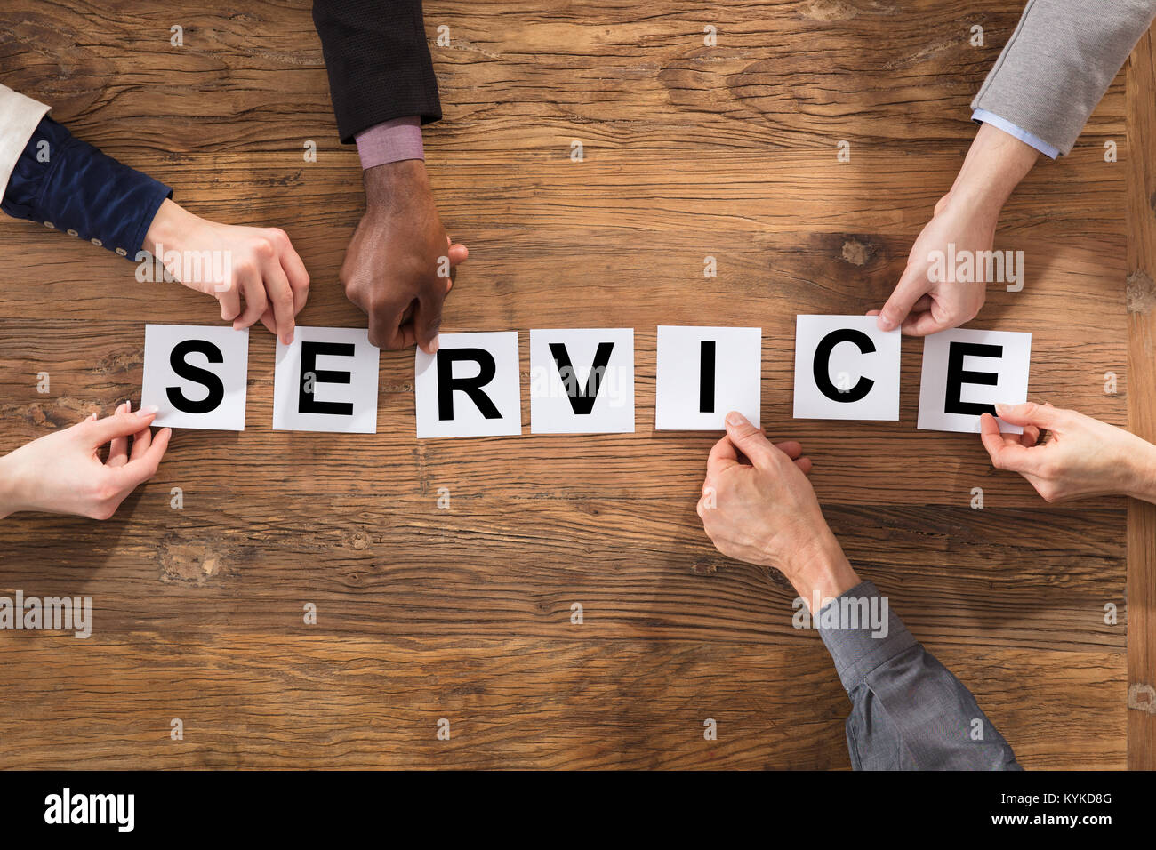 Hands holding the word team hi-res stock photography and images - Alamy