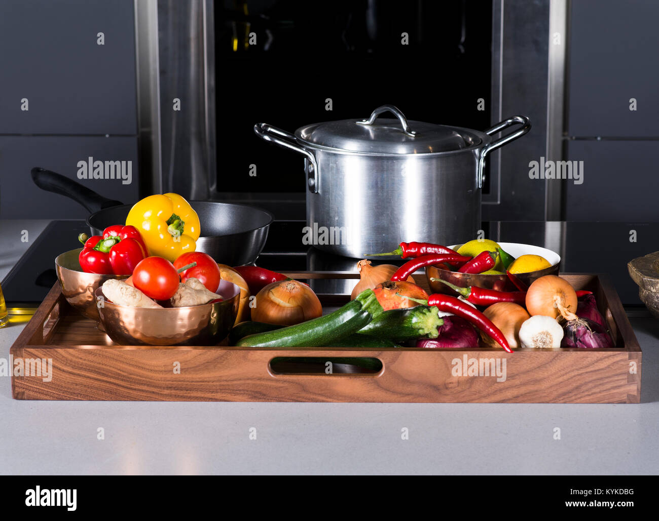 Stainless Steel cooking pan in kitchen with vegetables Stock Photo - Alamy