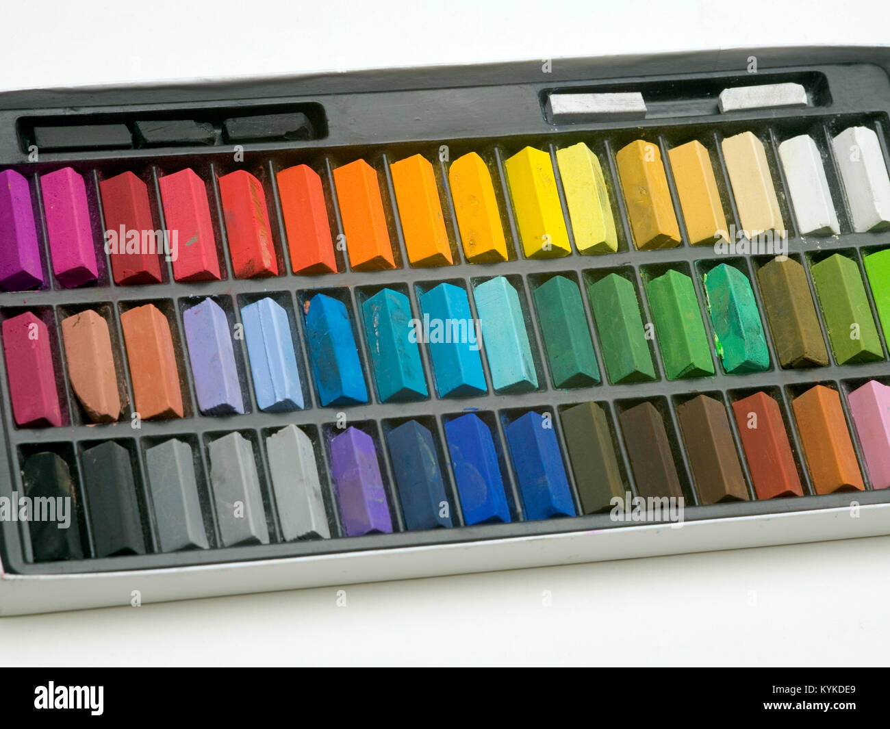Used multi-coloured artists pastel crayons Stock Photo - Alamy
