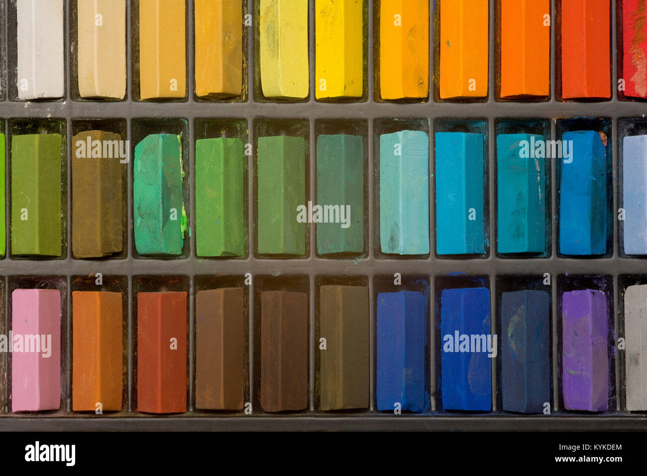 Multi coloured artists pastel crayons pattern close up Stock Photo - Alamy
