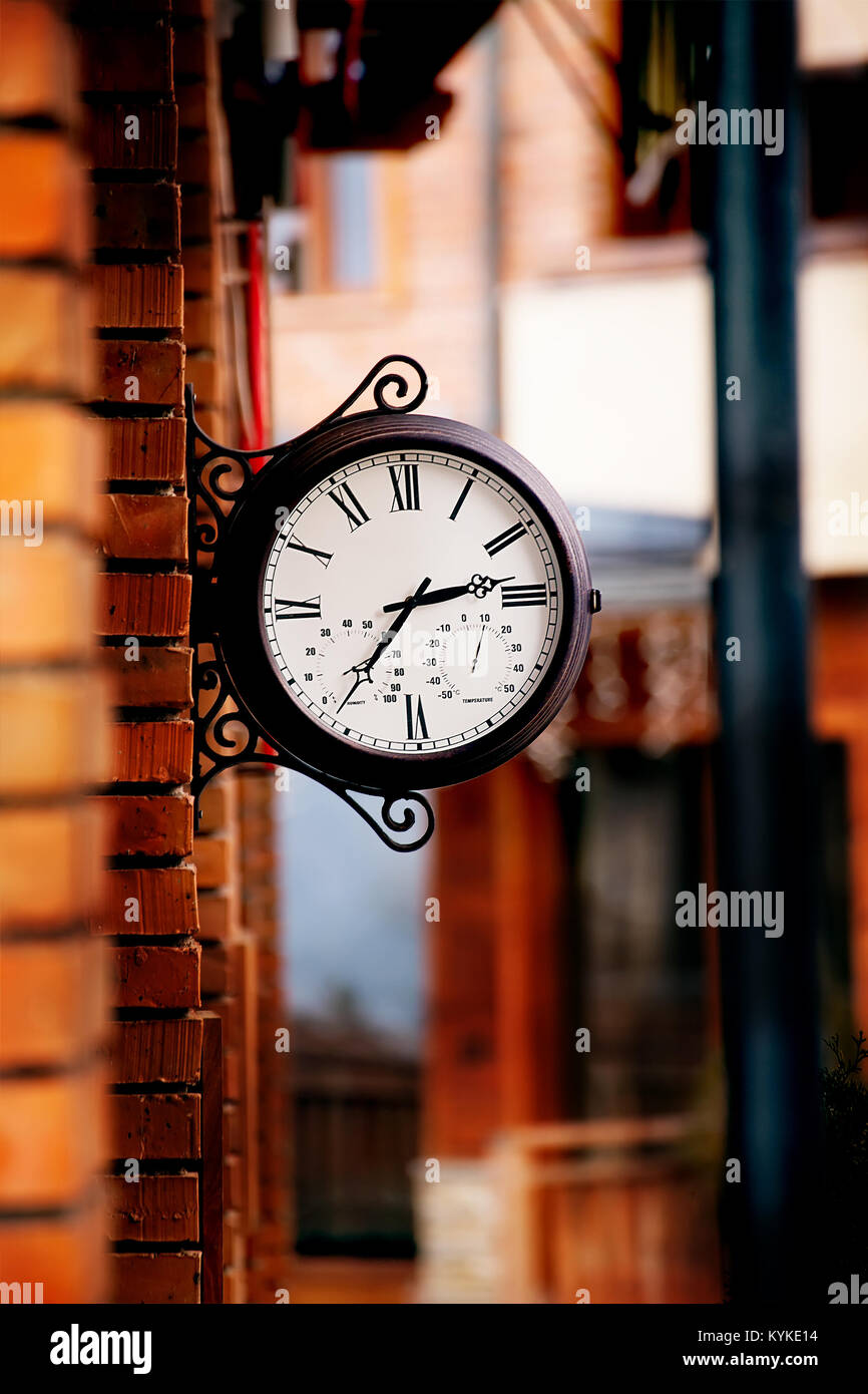 vintage street clock in holiday mountain village Stock Photo - Alamy