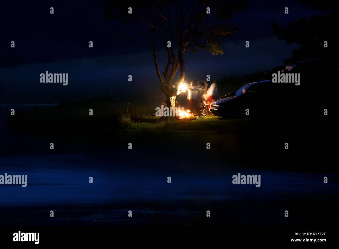 night camp fire on lake beach Stock Photo - Alamy