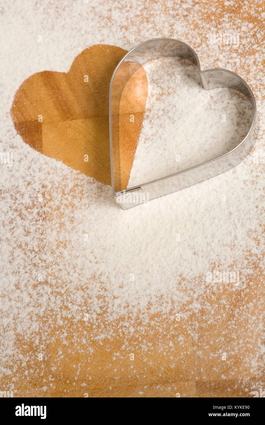 A single heart shaped cookie cutter on a flour background Stock Photo ...