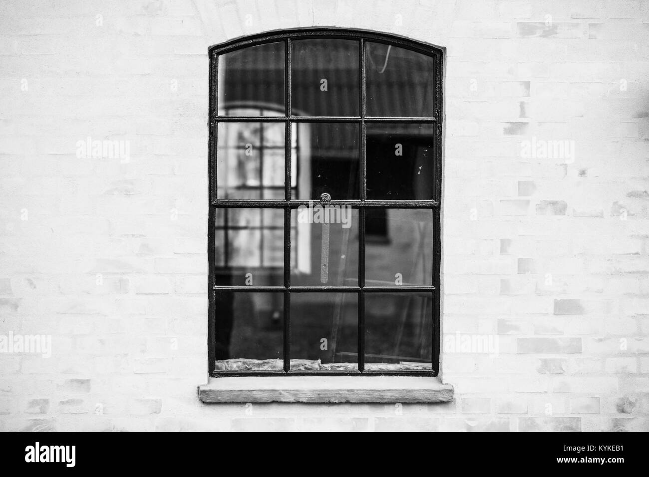 Old fashioned window with transparent glass in black and white on a ...