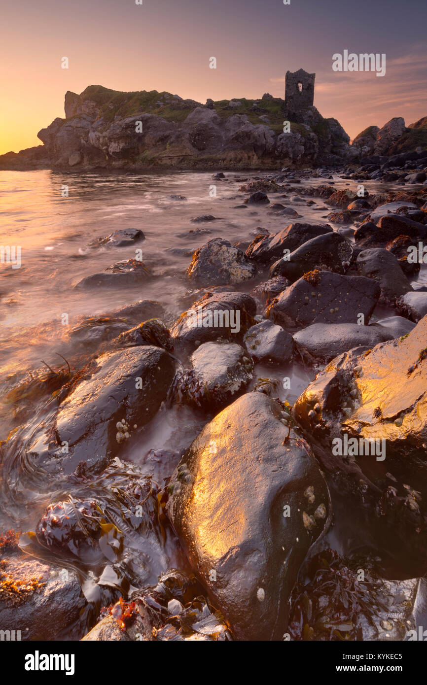 Sunrise at Kinbane Head with the ruins of Kinbane Castle on the ...