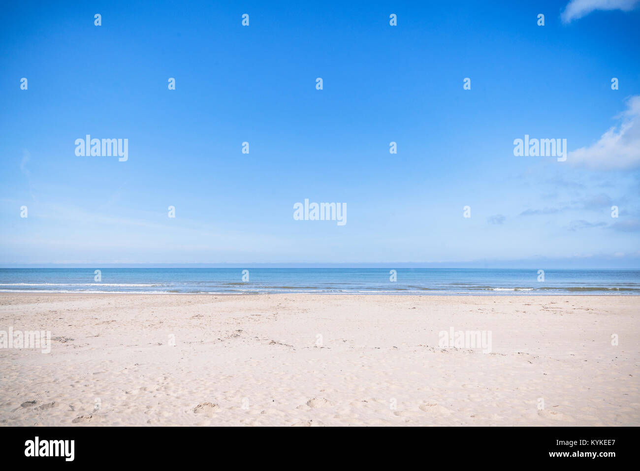 Empty beach by the sea in the summer with blue sky and dry sand Stock ...