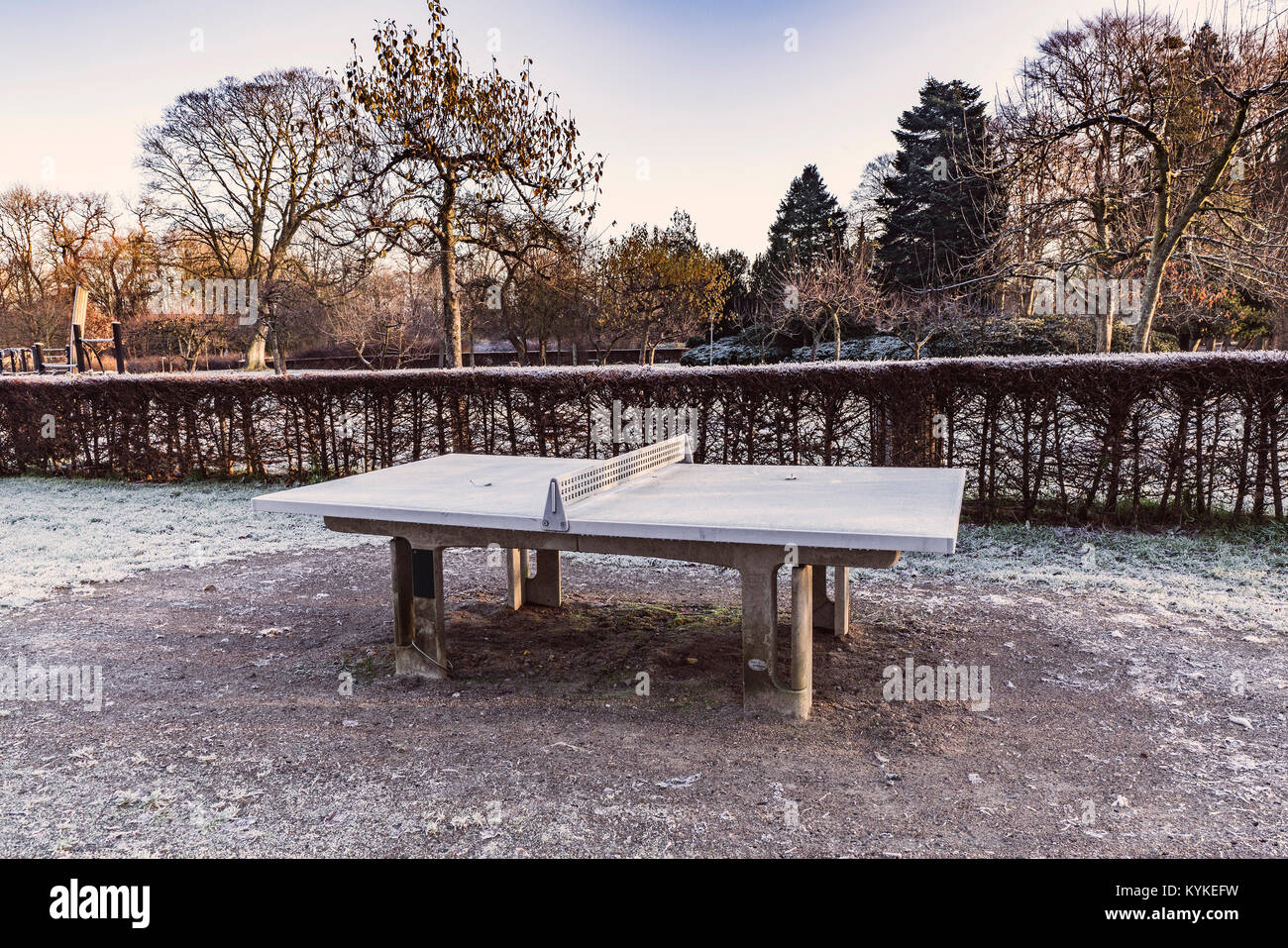 Outdoor table tennis made of concrete standing in a park in the winter ...