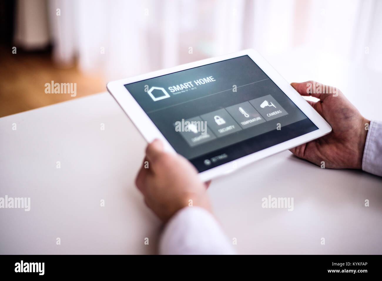 A tablet with smart home screen Stock Photo - Alamy