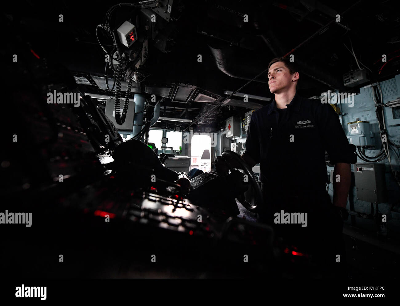 ATLANTIC OCEAN (Oct. 16, 2017) Seaman Joseph Corso mans the helm of the ...