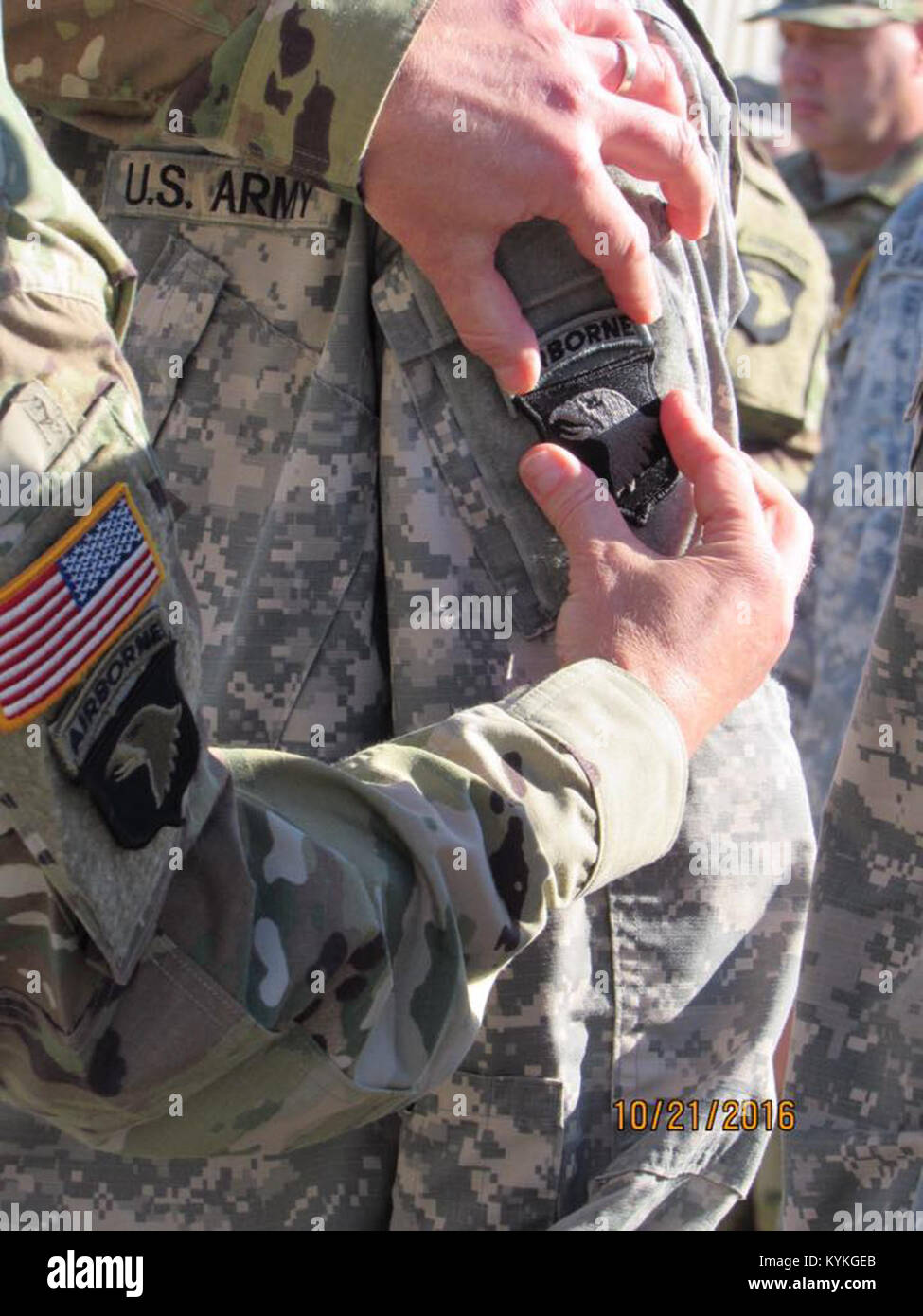 A Soldier with the 2123rd Transportation Company receives the patch of ...